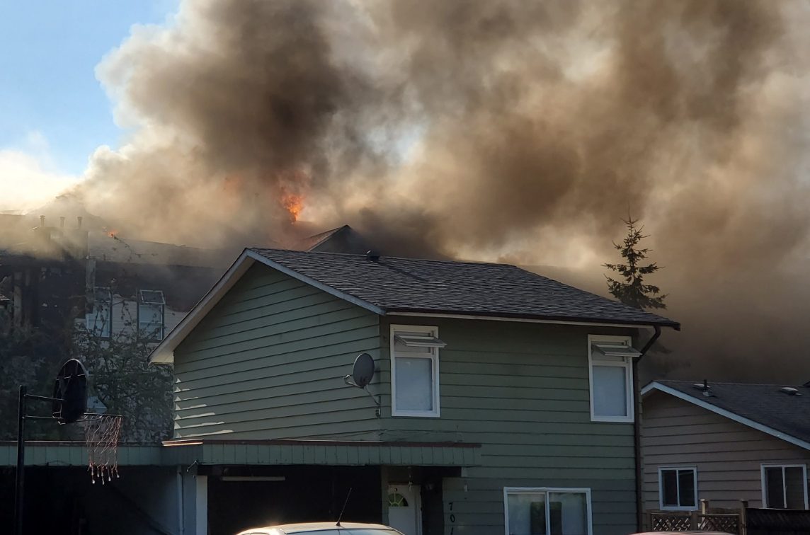 Surrey fire continues to burn due to challenging roof | CityNews Vancouver