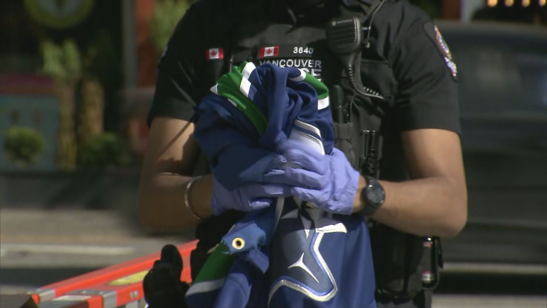 Vancouver Canucks jerseys on English Bay statues burned